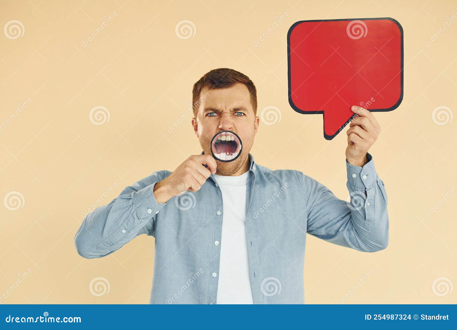 Angry and Mad. Man Standing in the Studio with Empty Signs for the Text ...