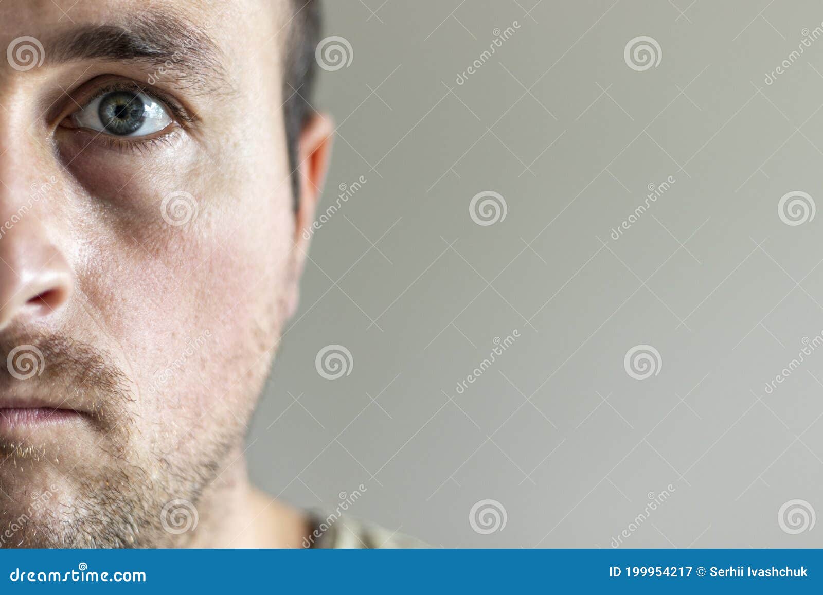 Angry Male Half Face Portrait On Gray Background. Royalty-Free Stock ...