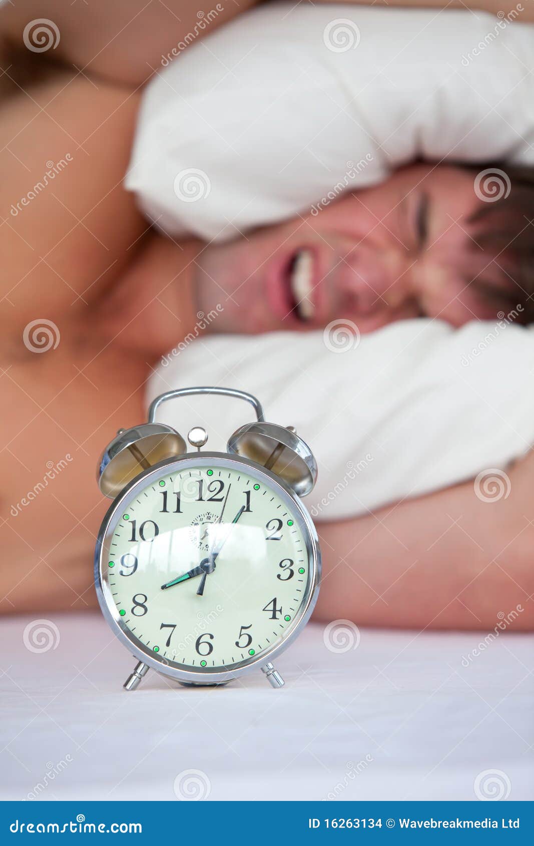 Angry Man in Bed Annoyed by His Alarm Clock Stock Photo - Image of ...