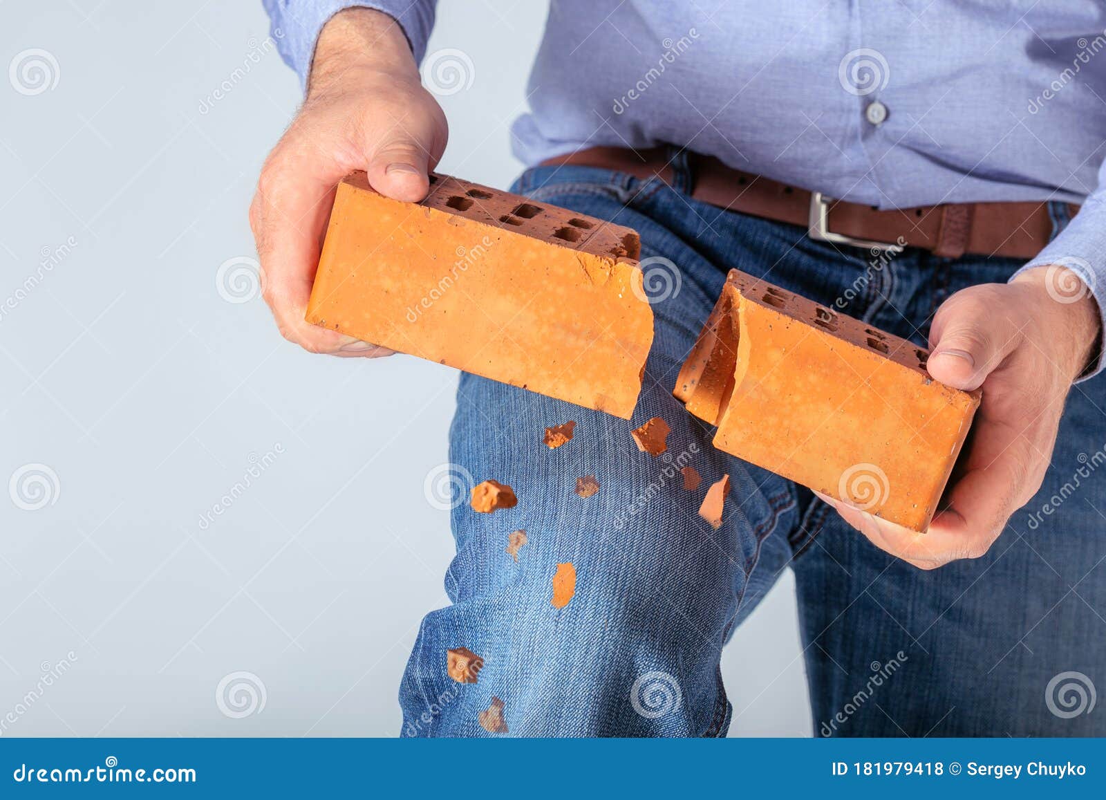 Angry Man Breaking a Brick. the Concept of Breaking Relations Stock ...