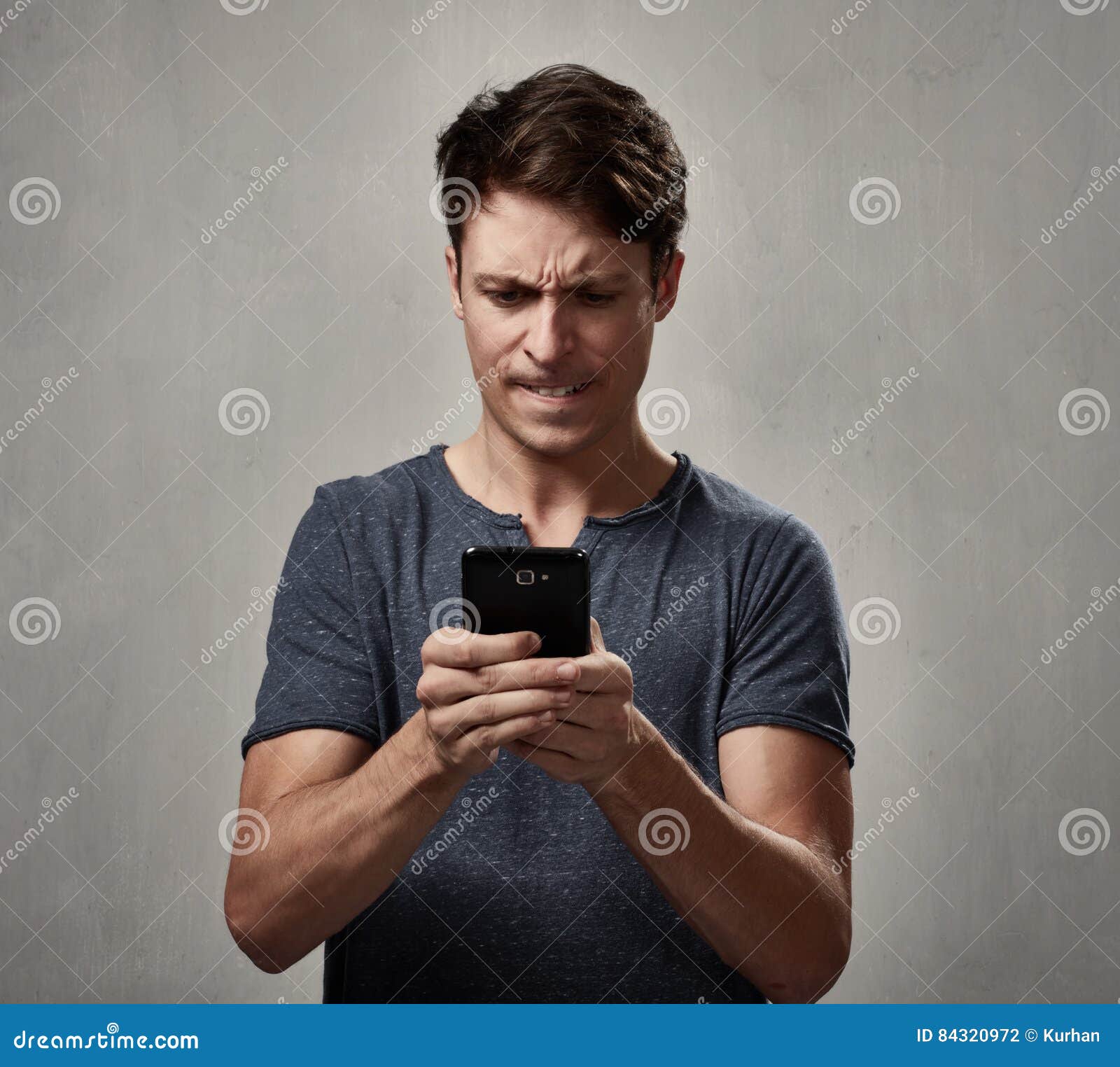 Angry man with cell phone. stock photo. Image of people - 84320972