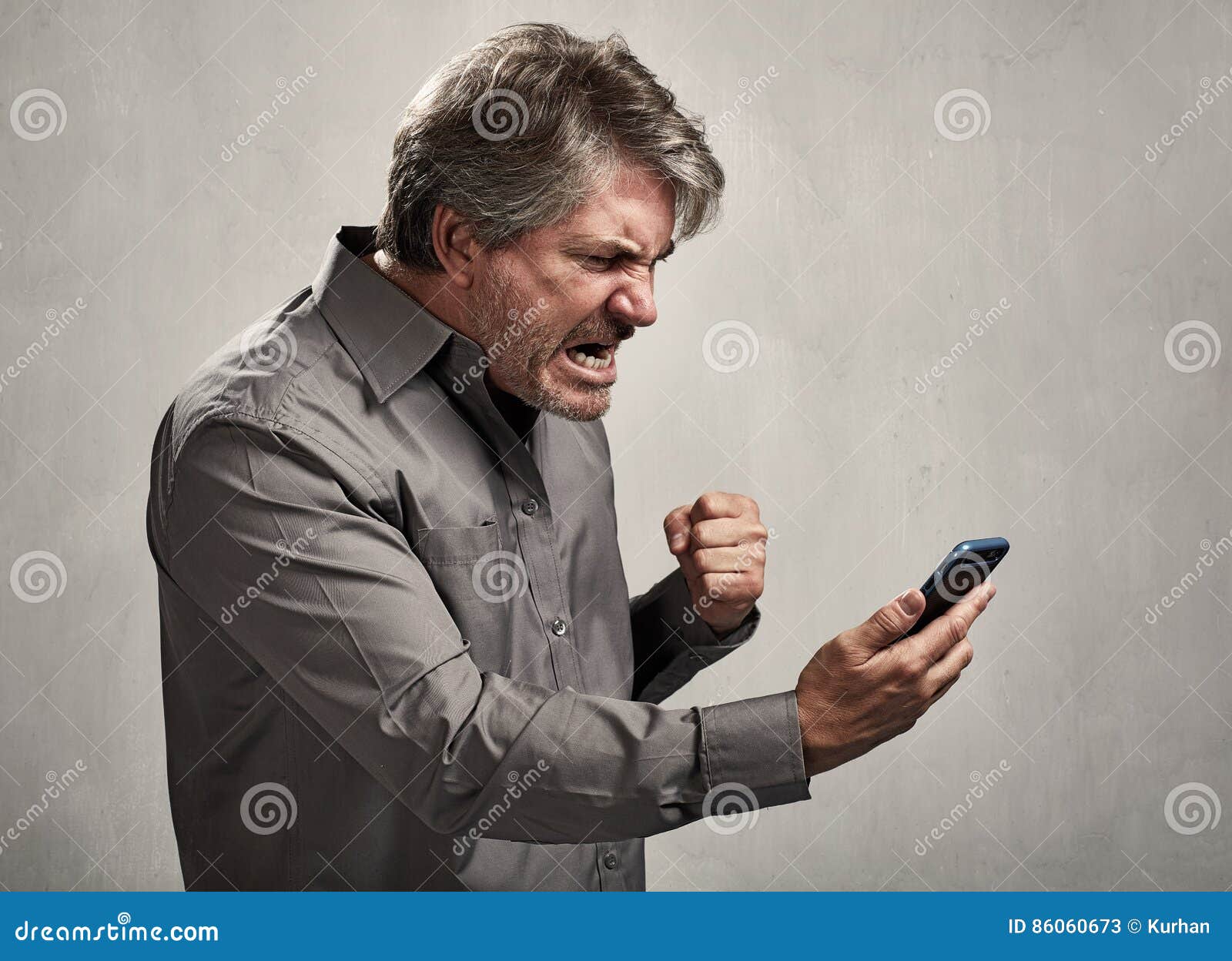 Angry Man with cellphone stock image. Image of anger - 86060673