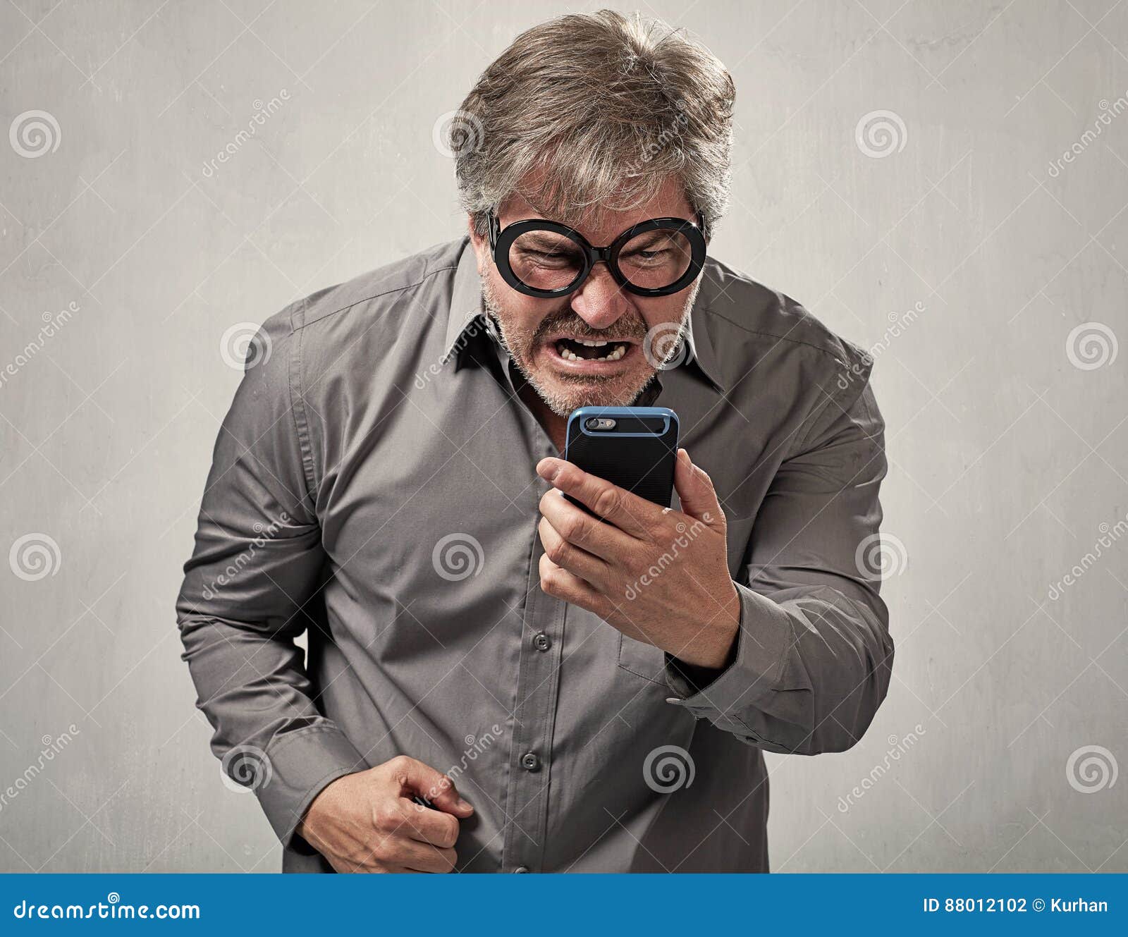 Angry Man with cellphone stock photo. Image of male, electronics - 88012102