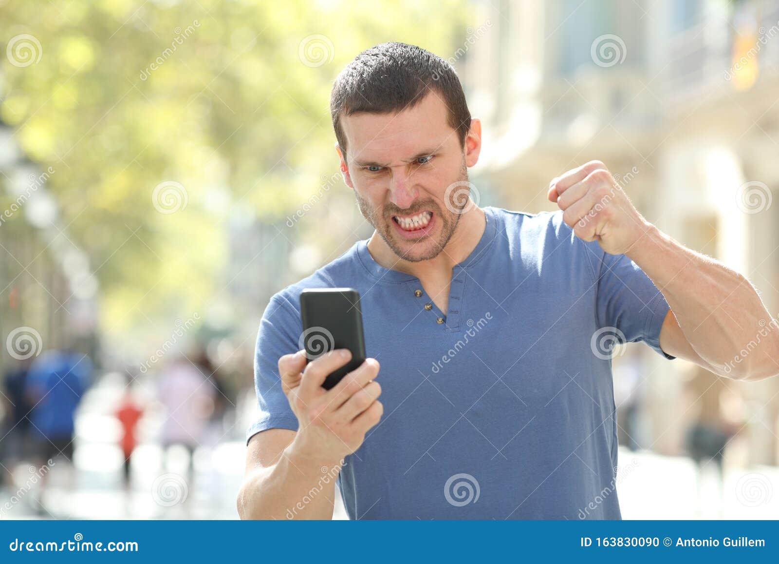 Angry Man Checking Crashed Smart Phone in the Street Stock Photo ...