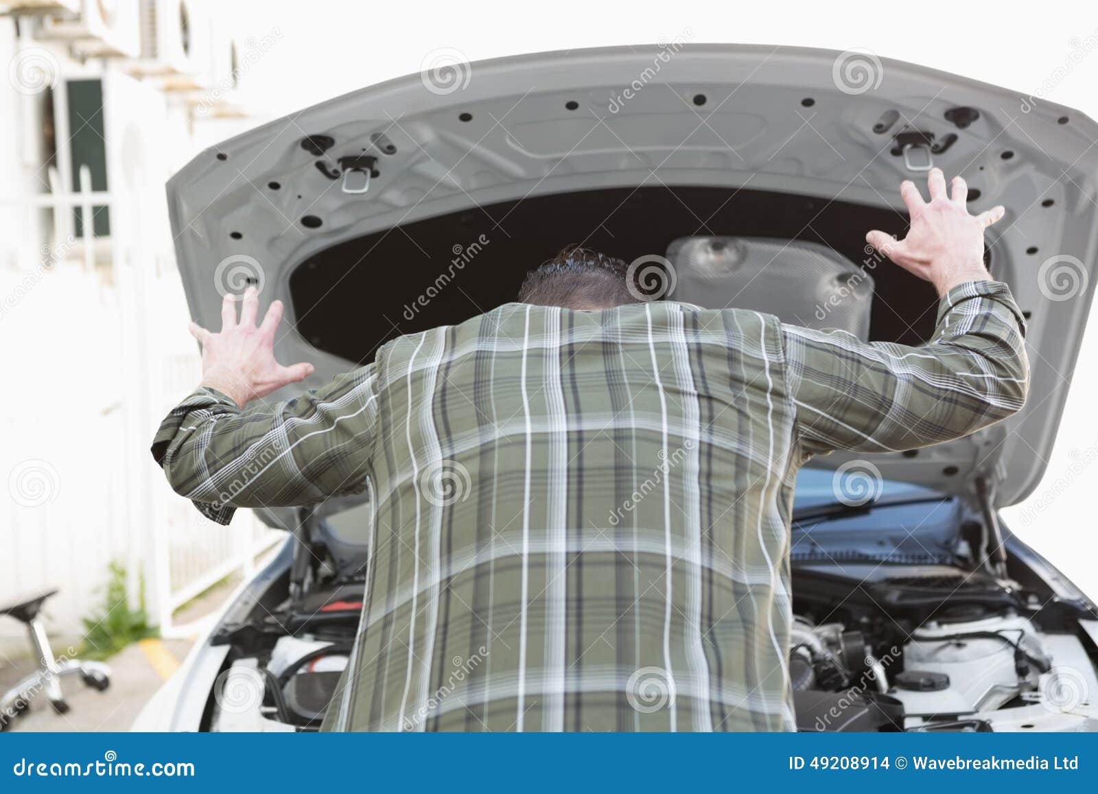 Angry Man Checking His Car Engine after Breaking Down Stock Photo ...