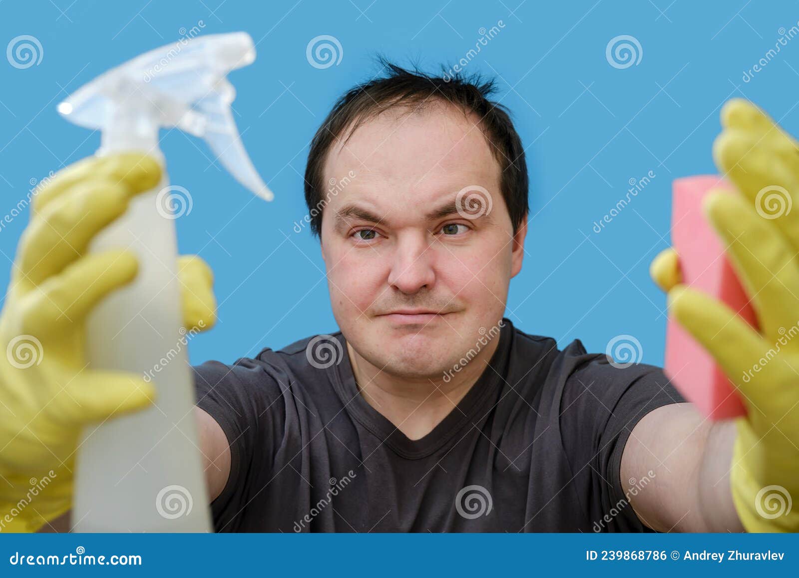 Angry Man Cleaner in Yellow Gloves Pulls His Hands Forward, Portrait on ...
