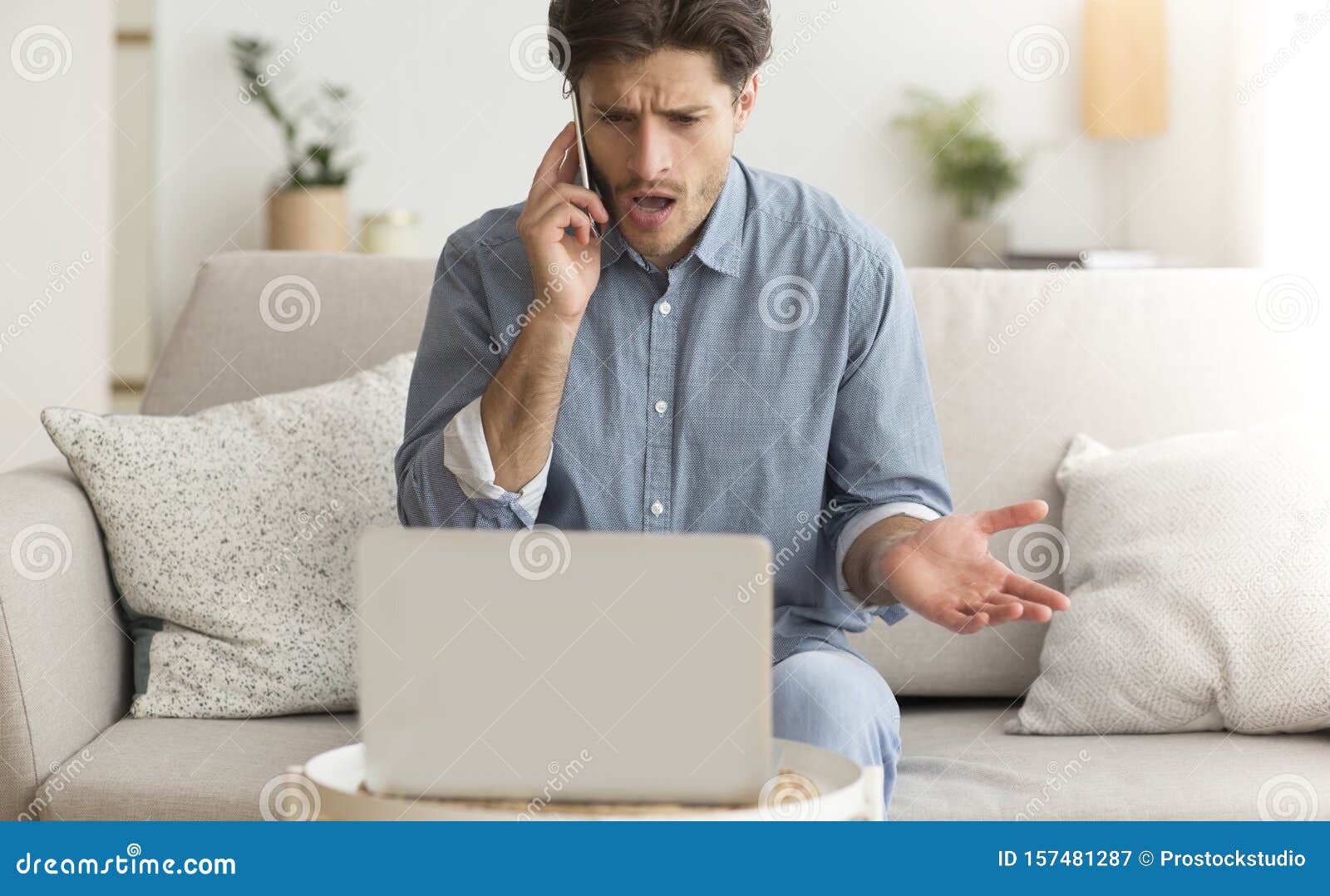 Angry Man Complaining about Problems by Cellphone Sitting on Couch ...