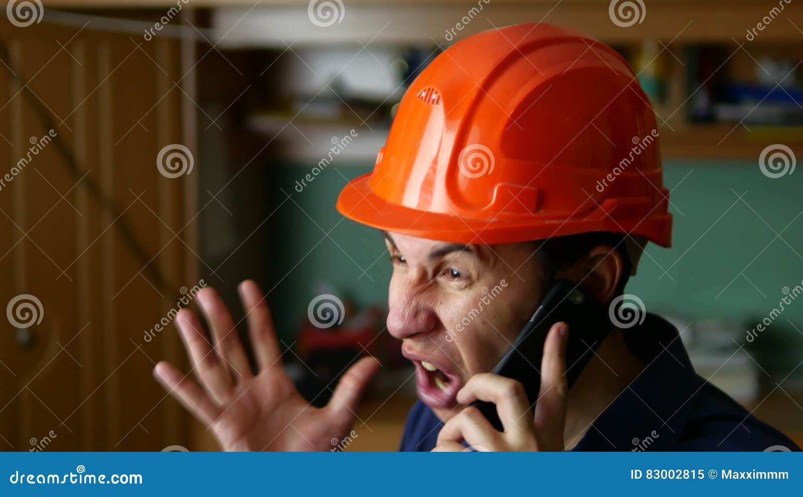 Angry Man Construction Worker in a Hardhat Shouting, Talking on the ...
