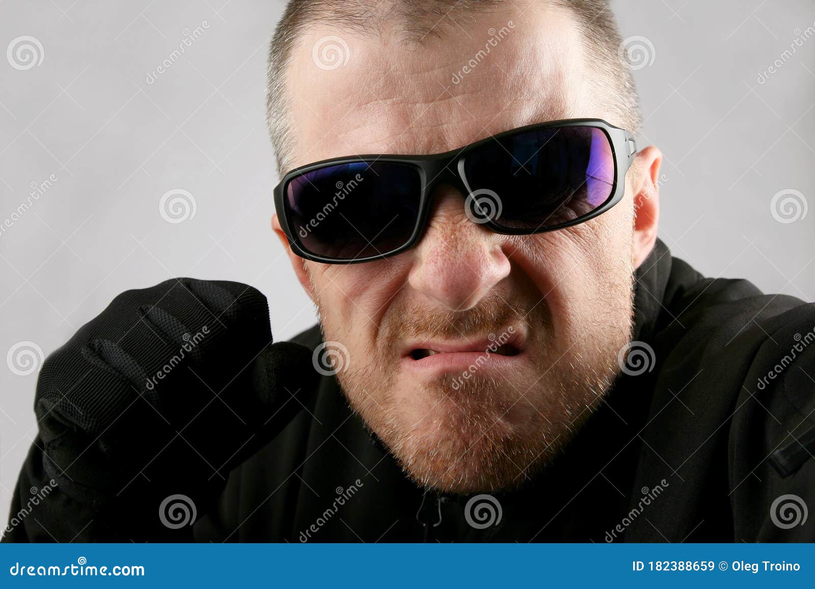 Angry man in dark glasses stock image. Image of human - 182388659
