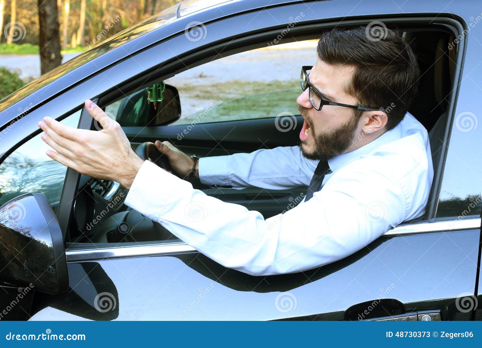 Angry man driving a car stock image. Image of shout, stress - 48730373
