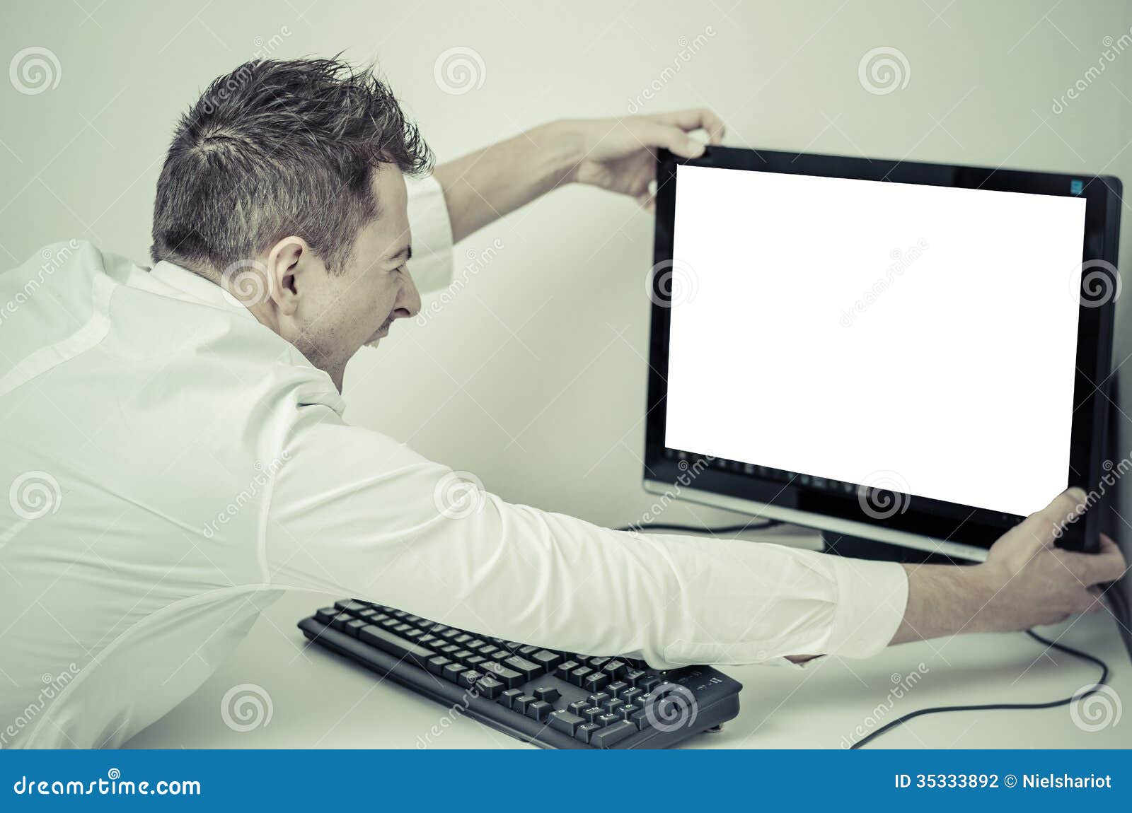 Angry Man Grabbing His Computer with a White Screen Stock Photo - Image ...