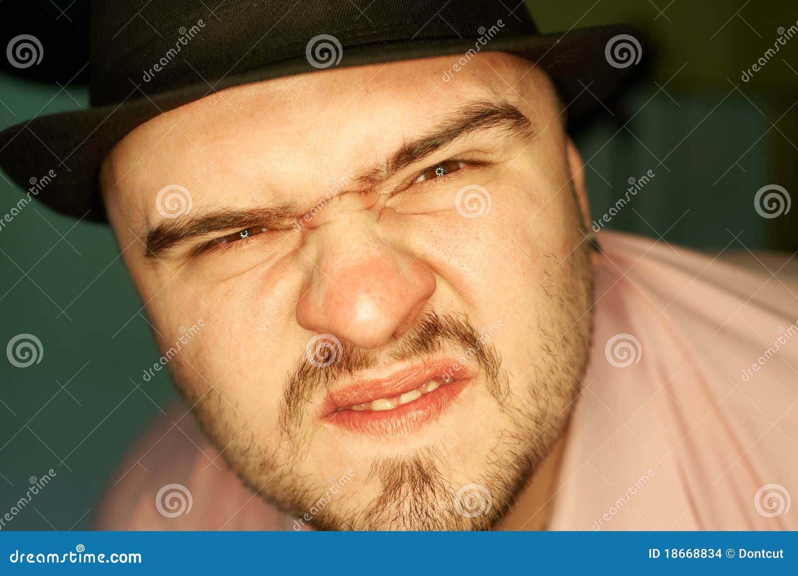 Angry man in hat. stock photo. Image of gangster, mustache - 18668834