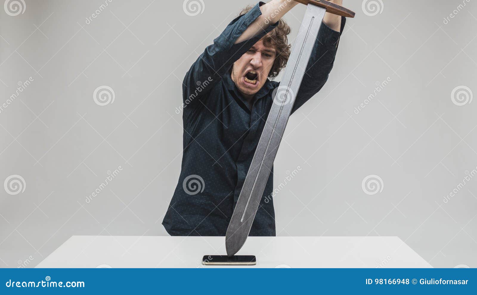 Angry Man Hitting His Phone with a Sword Stock Photo - Image of concept ...