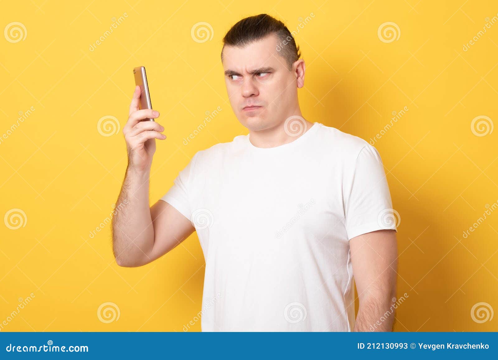 Angry Man Holding a Smartphone. Aggressive Man Talking on the Phone ...