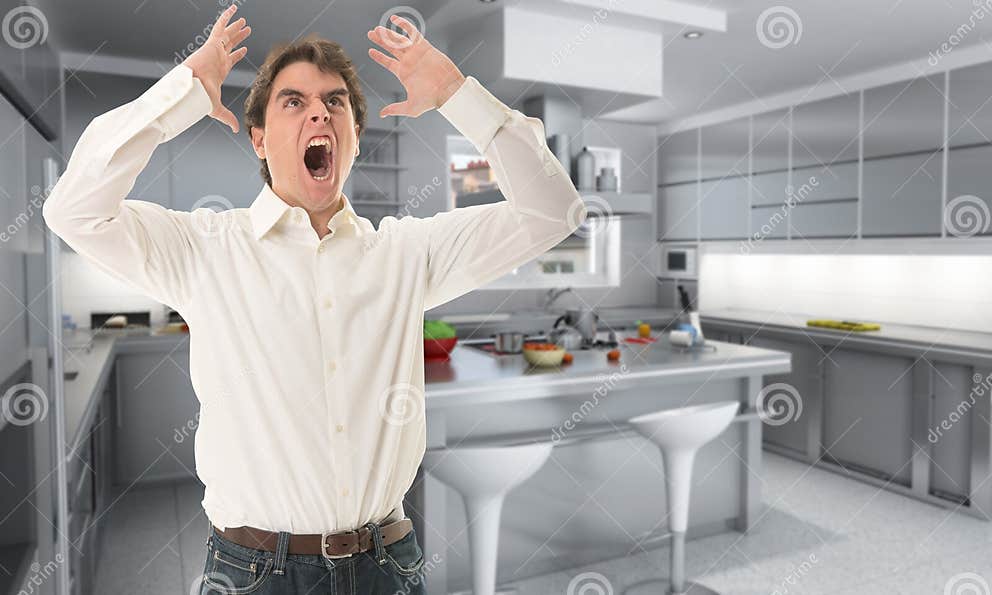 Angry man in the kitchen stock photo. Image of irritation - 50374290