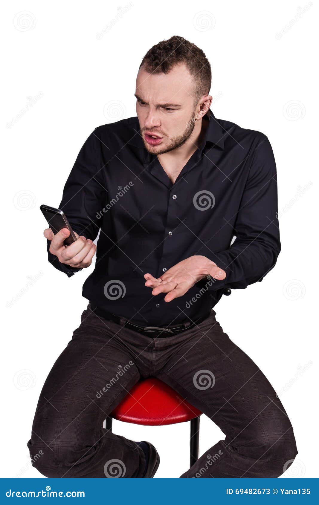 Angry Man Looking at His Mobile Phone with a Furious Expression Stock ...
