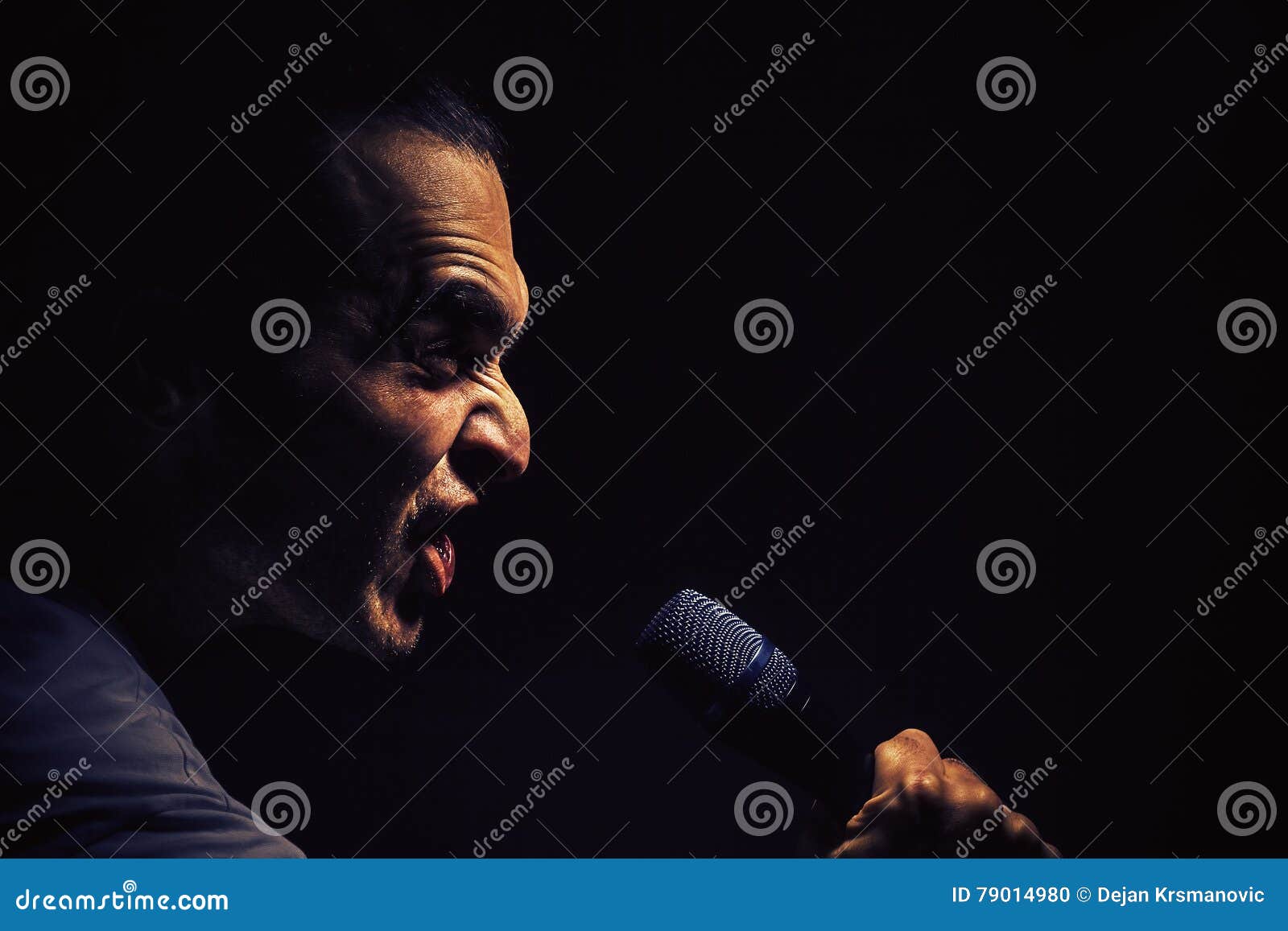 Angry Man with Microphone stock photo. Image of action - 79014980