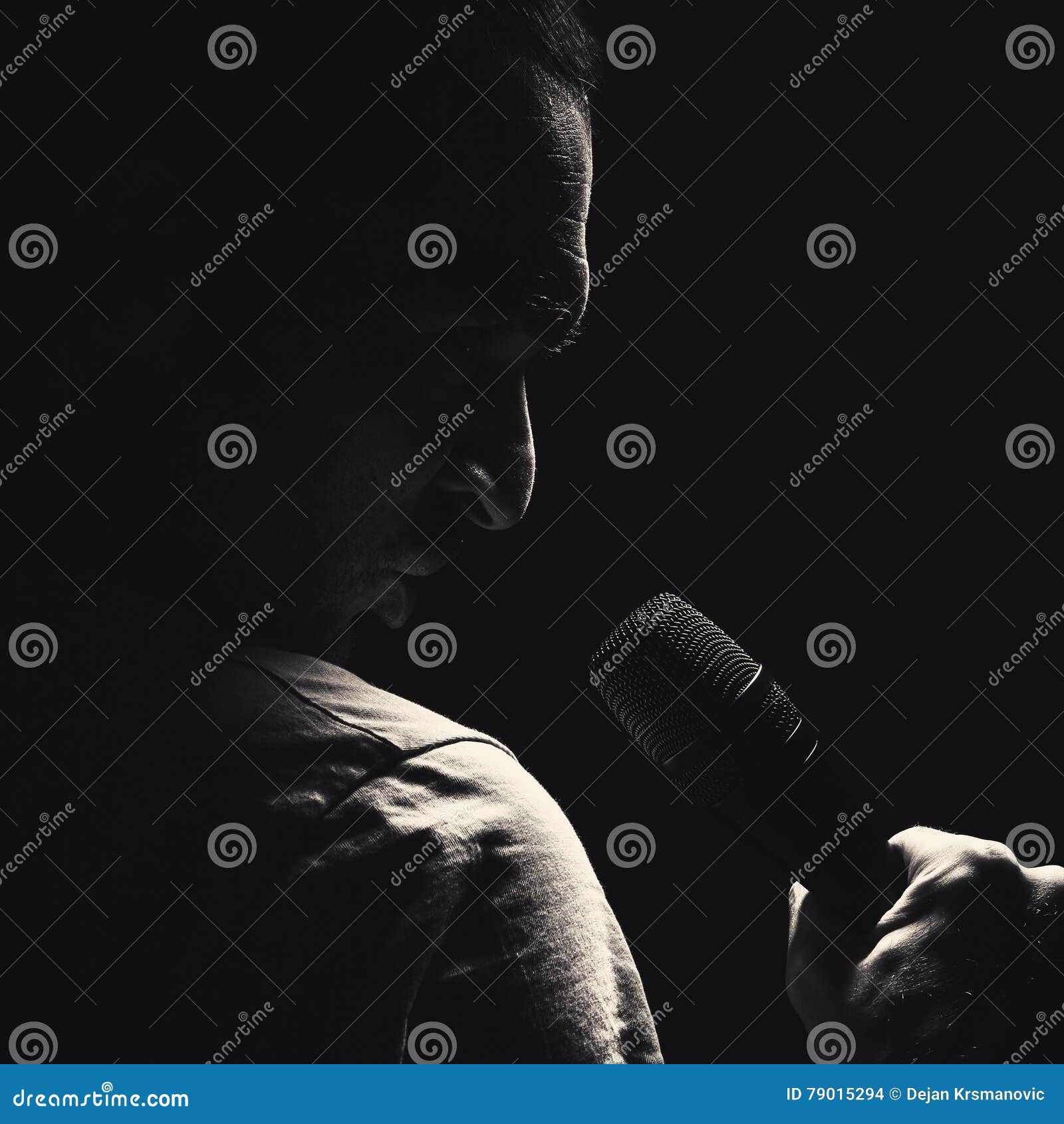 Angry Man with Microphone stock photo. Image of dark - 79015294