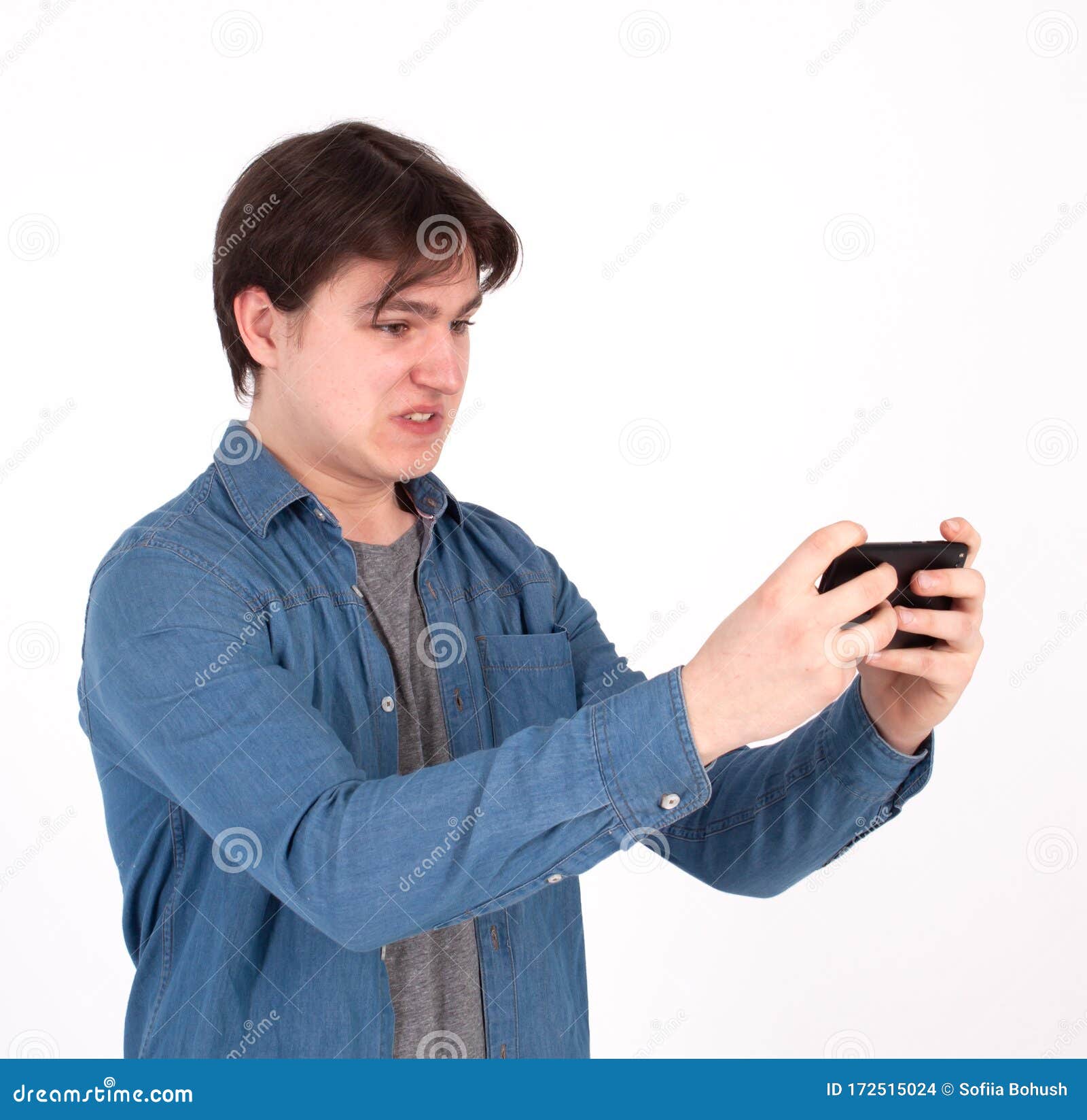 Angry Man Plays Mobile Game on His Smartphone Stock Photo - Image of ...