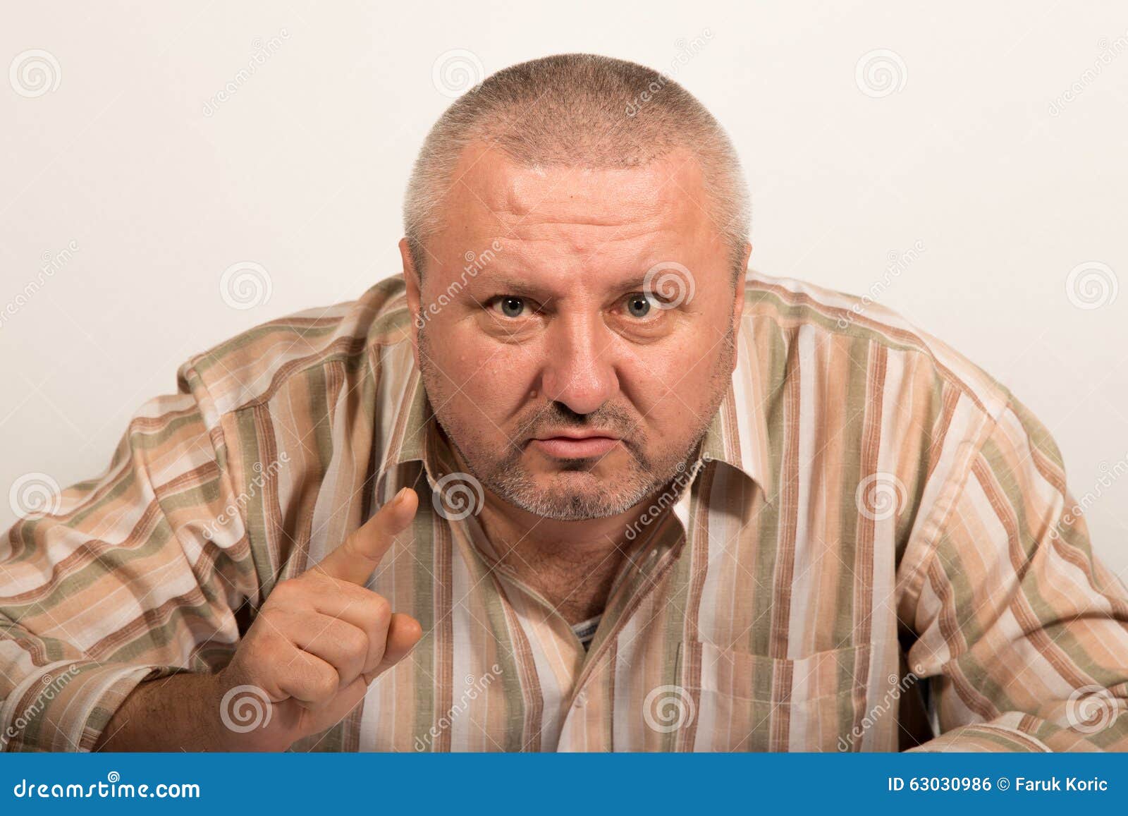 Angry man pointing finger stock photo. Image of facial - 63030986