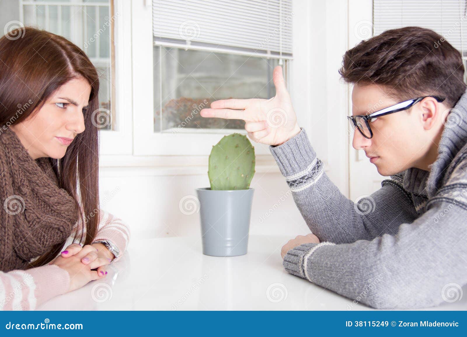 Angry Man Pointing at Woman Sitting Across the Table Stock Image ...