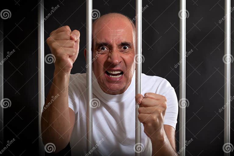 Angry man in prison stock image. Image of legal, latin - 63487333