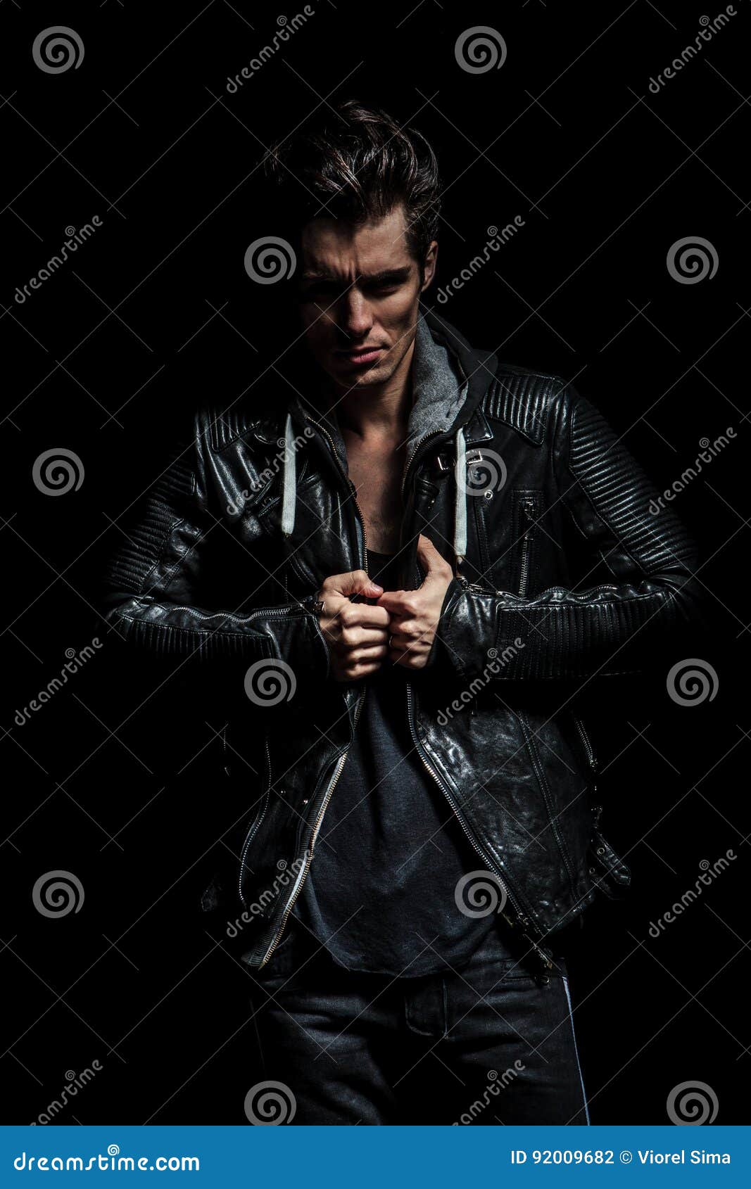 Angry Man Pulling His Leather Jacket`s Collar Stock Photo - Image of ...