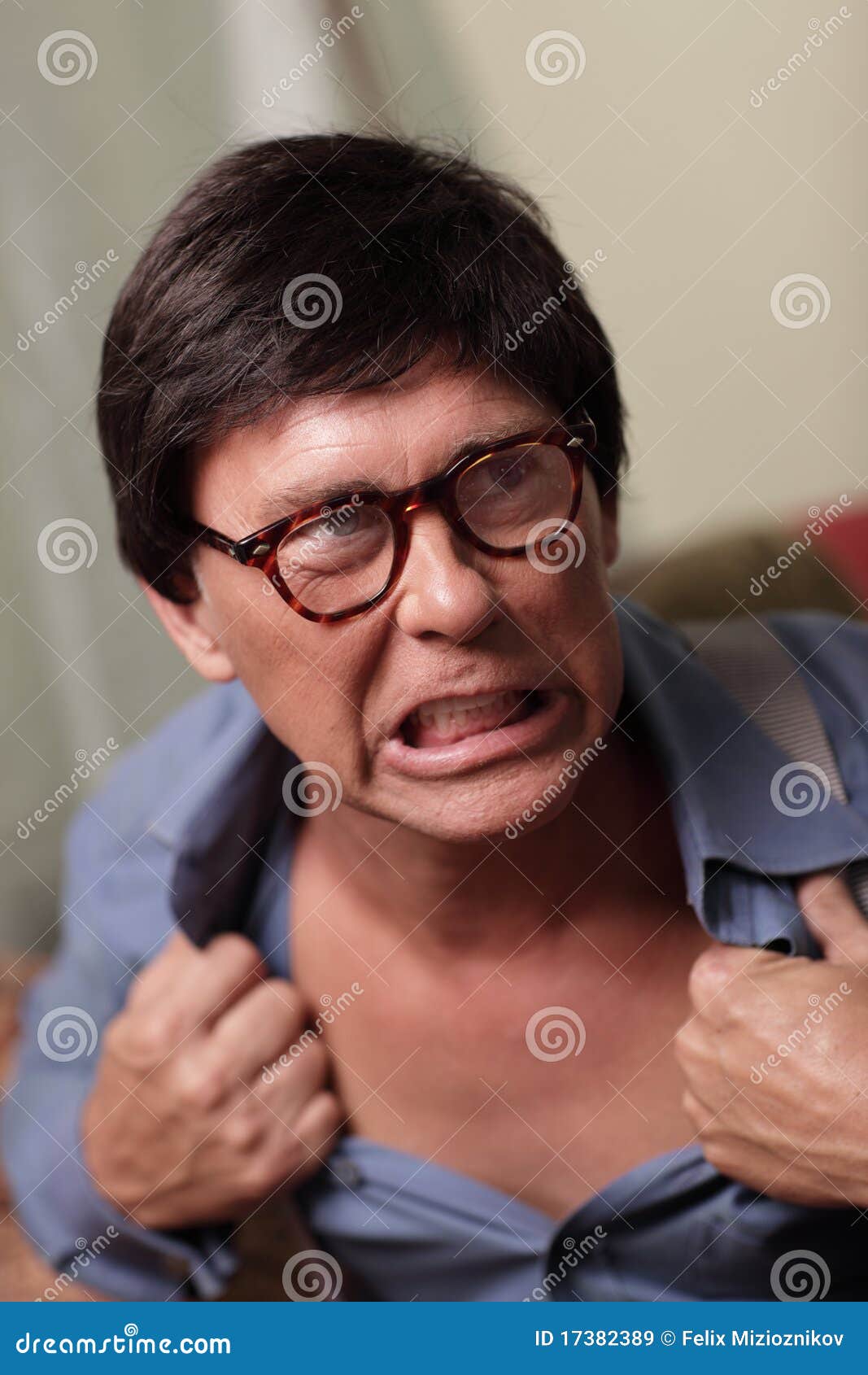 Angry Man Ripping of His Shirt Stock Image - Image of grunt, ripping ...