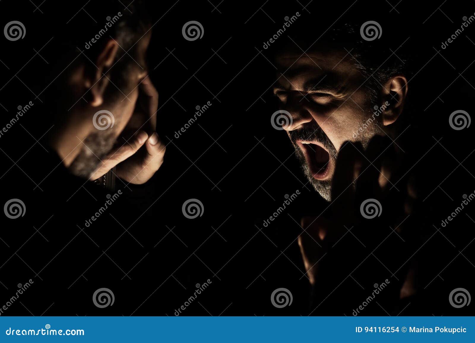 Angry Man Shouting in Front of Mirror at His Reflection Stock Photo ...