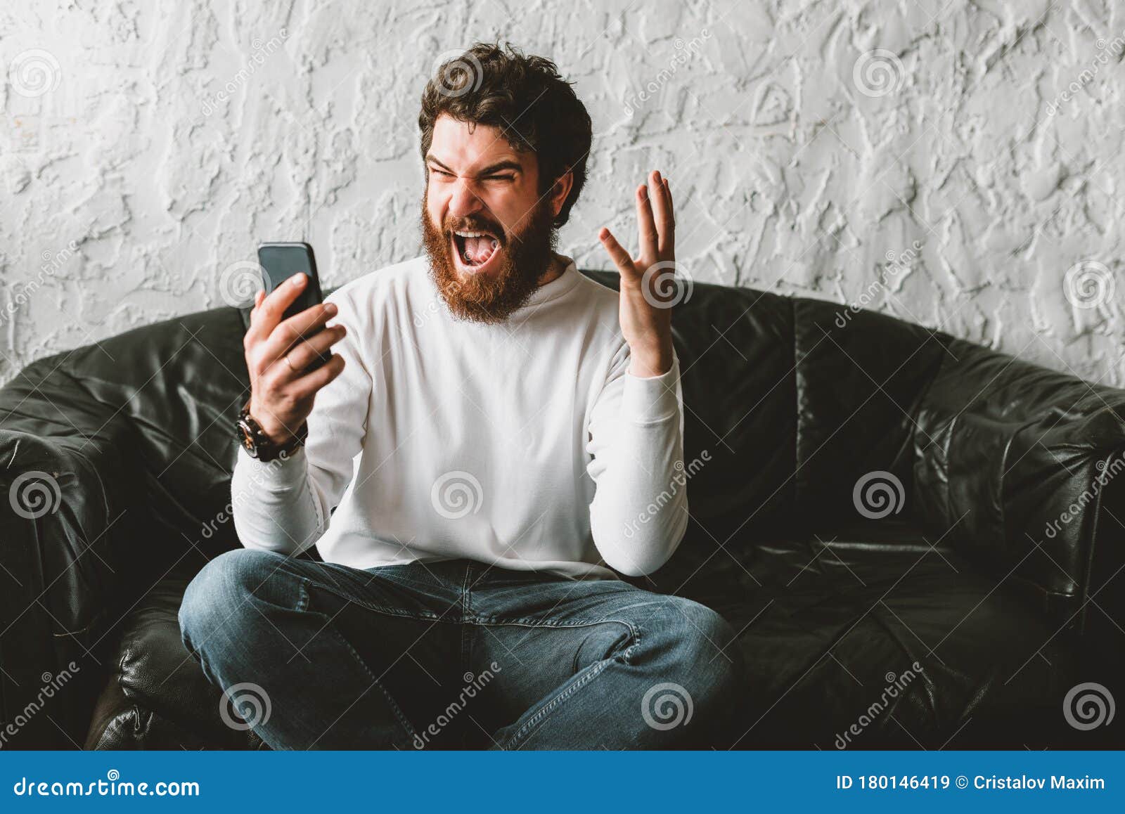 Angry Man Sitting on Sofa and Screaming at Smartphone Stock Image ...