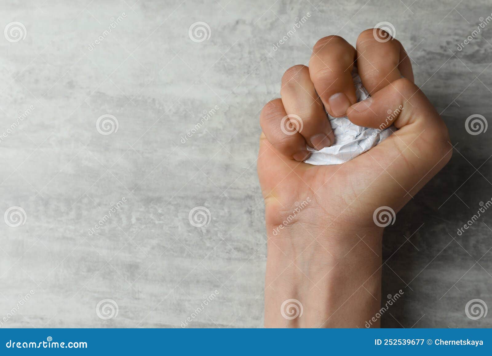 Angry Man Squeezing Paper at Table, Top View. Space for Text Stock ...