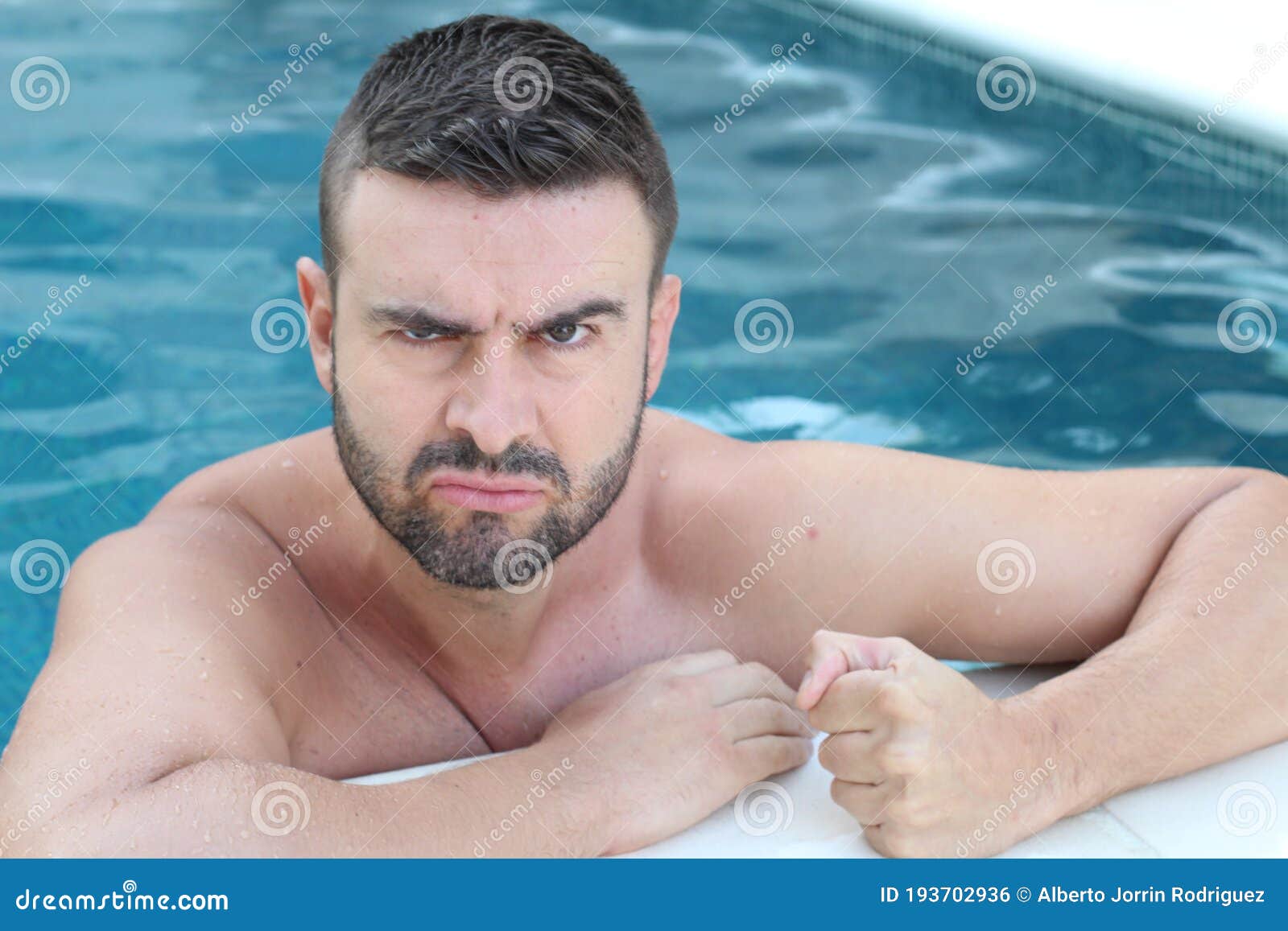Angry man in swimming pool stock photo. Image of heat - 193702936