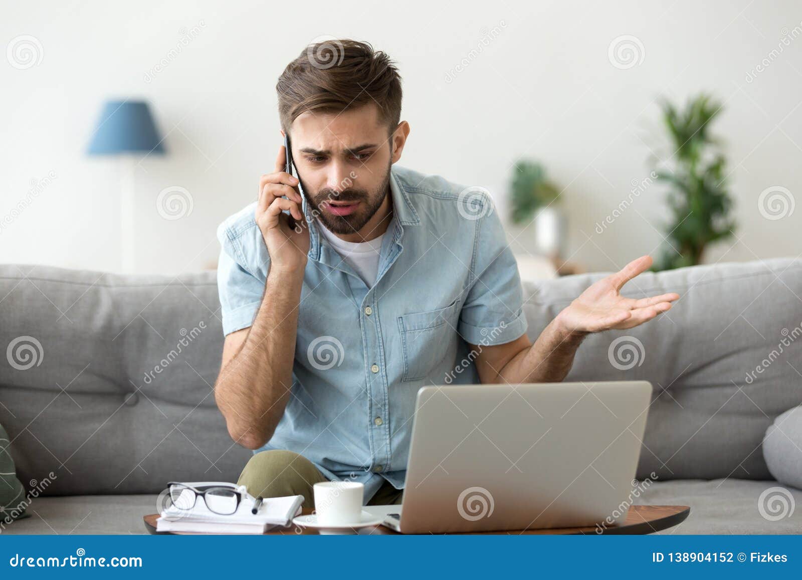 Angry Man Talking on Phone Disputing Over Computer Laptop Problem Stock ...