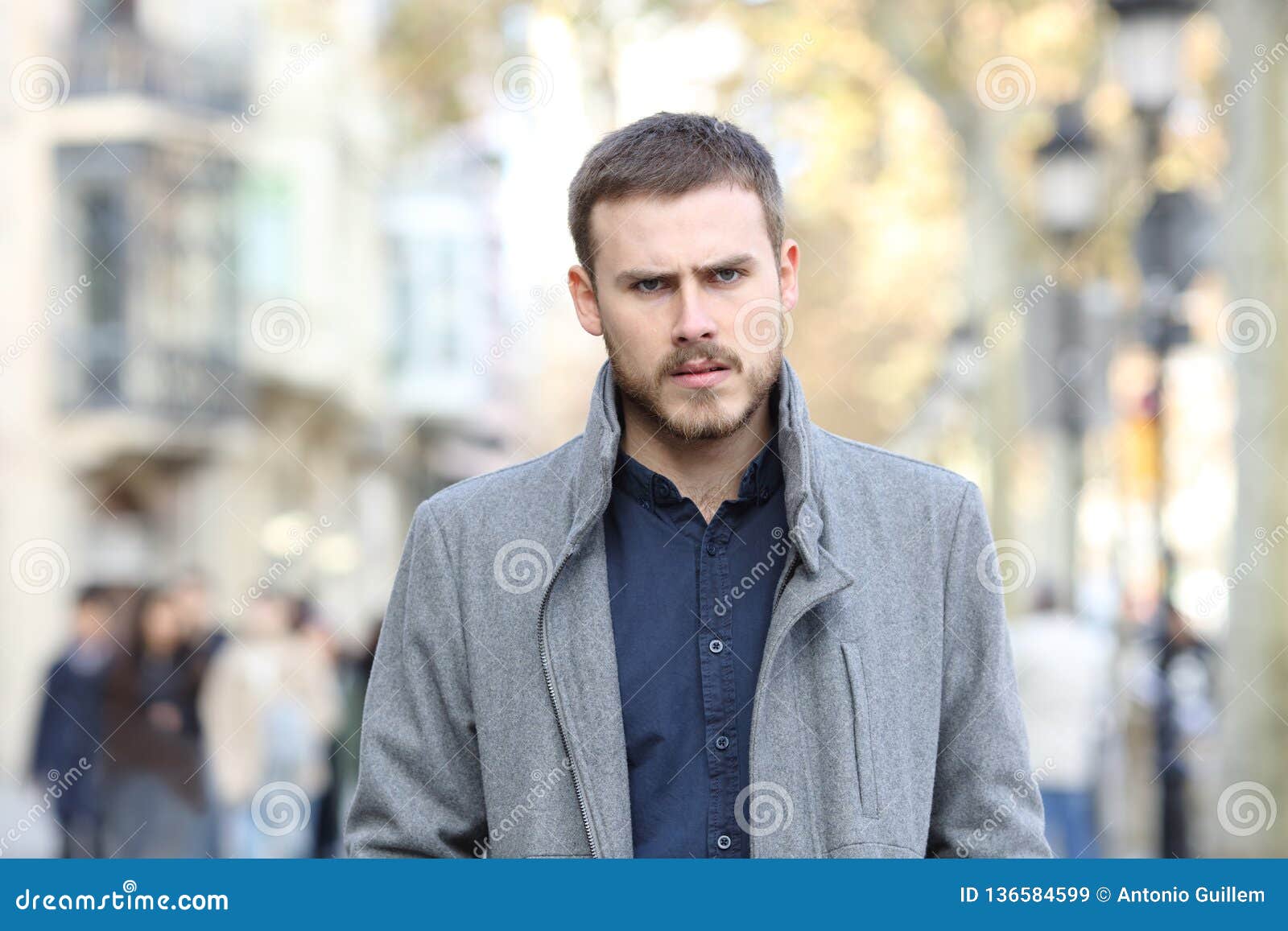 Angry Man Walking in the Street Looking at Camera Stock Image - Image ...