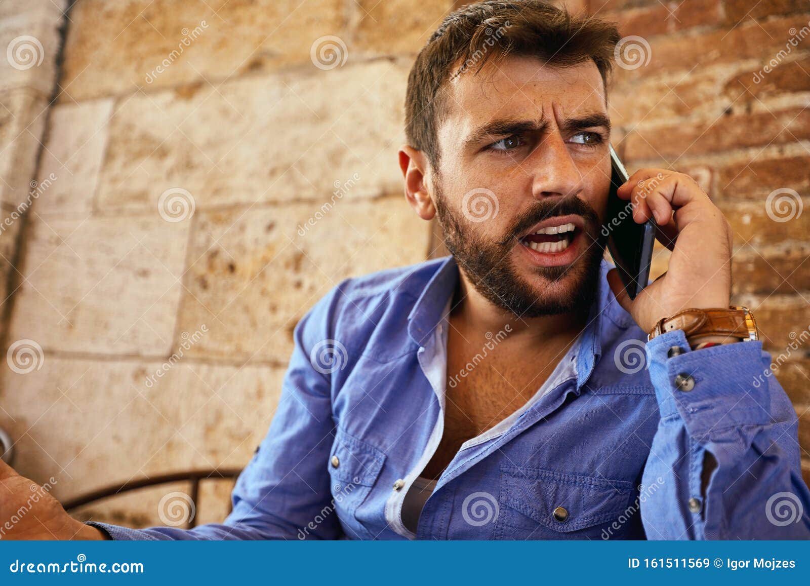 Angry Man Working and Talking on Phone at Street Stock Image - Image of ...