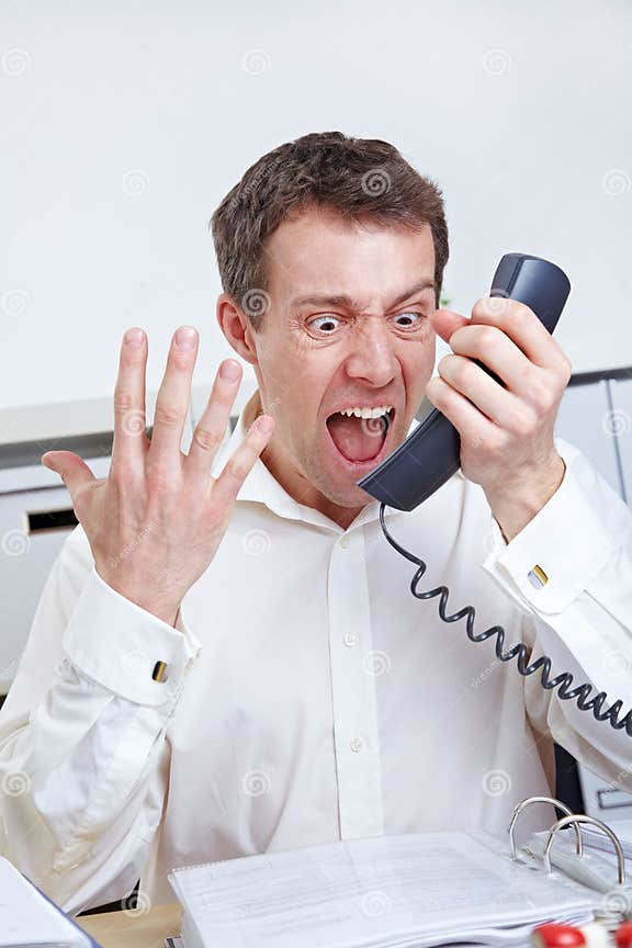 Angry man yelling at phone stock image. Image of head - 25518371