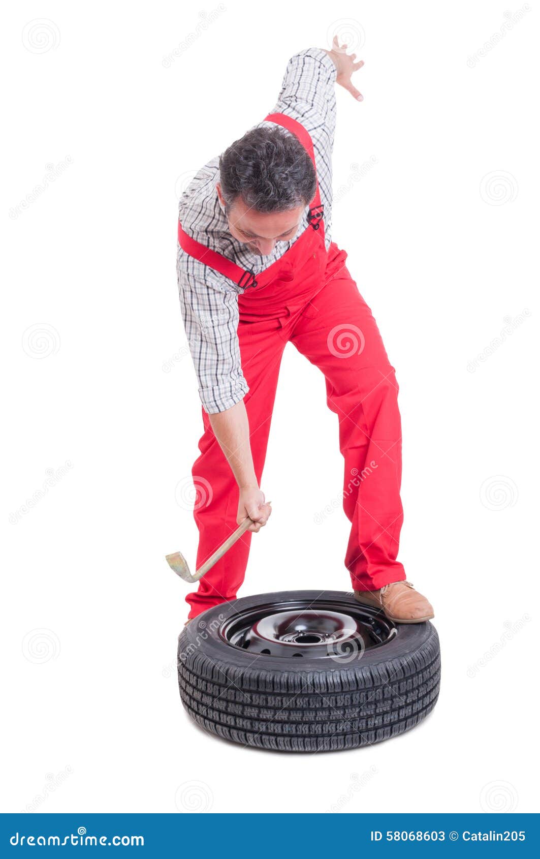 Angry Mechanic Changing Tire Stock Image - Image of garage, automobile ...