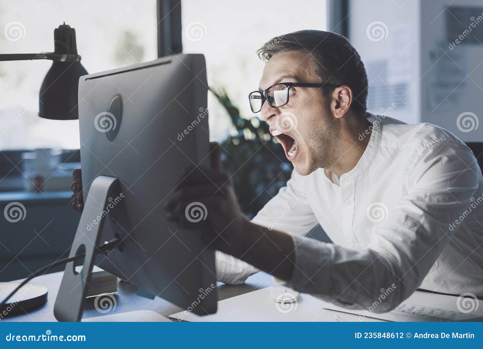 Frustrated Office Worker At Desk