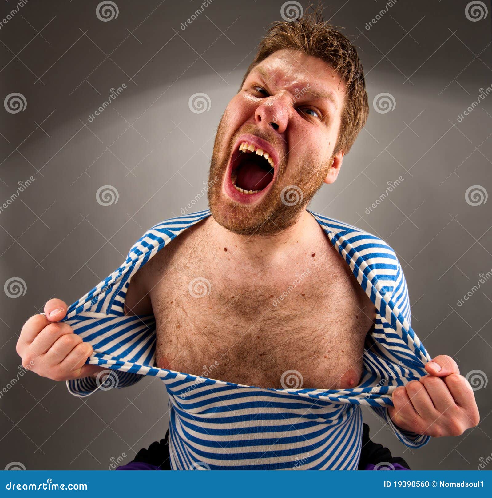Angry Prisoner Wearing Prison Uniform Holding Aluminum Dishes In ...