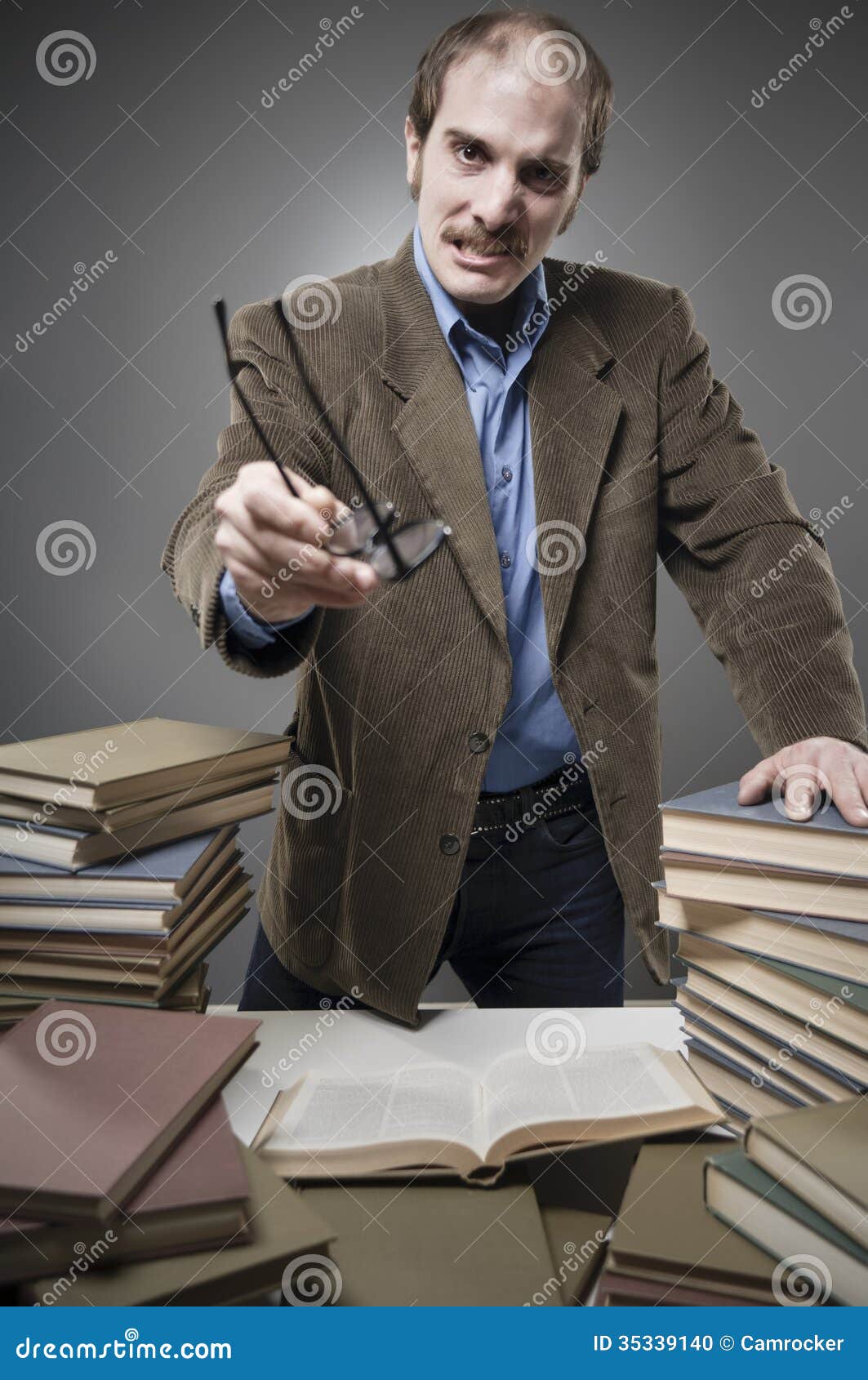 Angry Professor with a Stack of Books Stock Photo - Image of angry ...