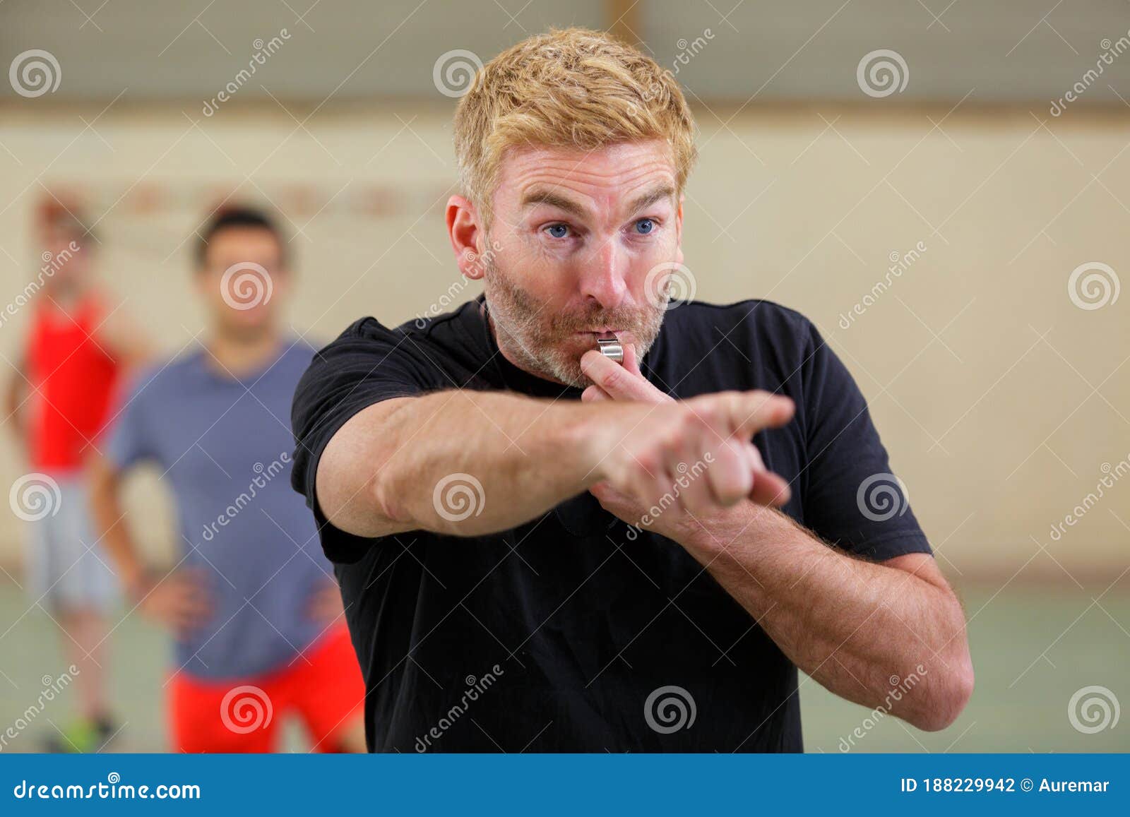 Angry Referee Blowing Whistle and Pointing with Hand Stock Photo ...