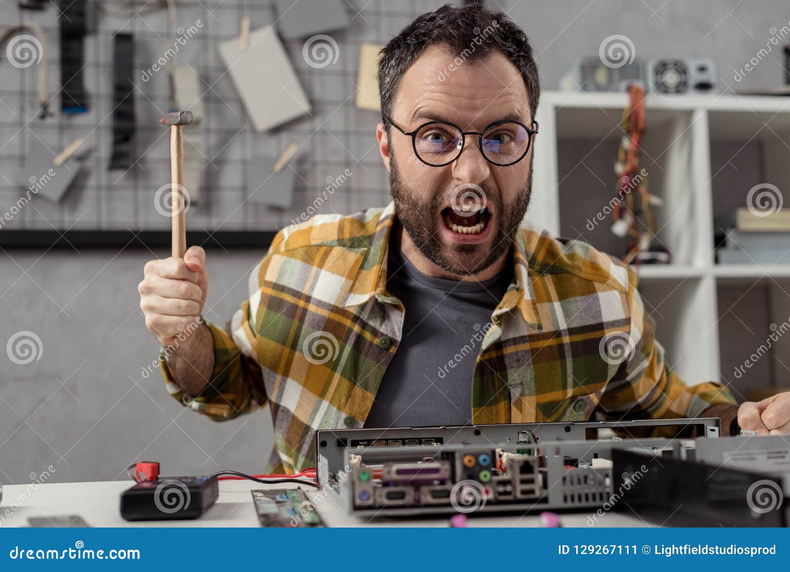 Angry Repairman with Hammer in Hand Against Broken Stock Image - Image ...
