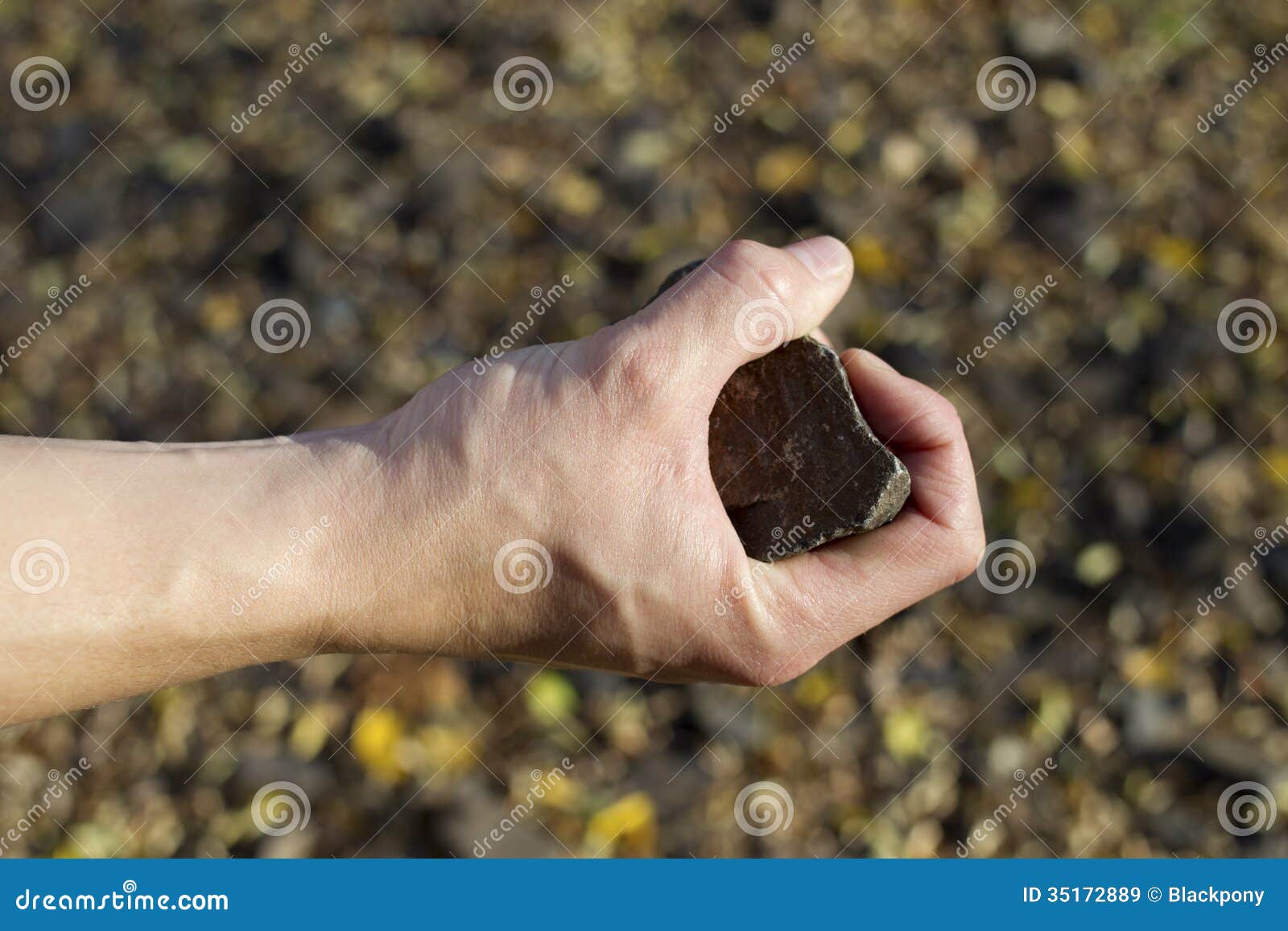 Angry rock stock image. Image of hand, cobbles, rock - 35172889
