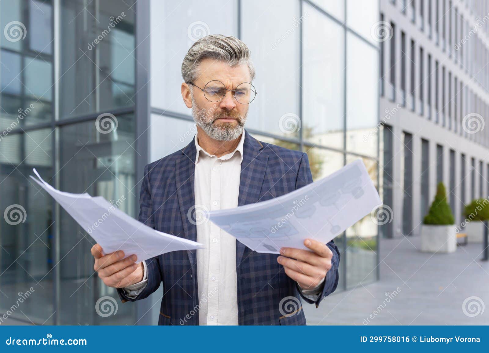Angry Senior Boss Standing on the Street in Front of the Office ...