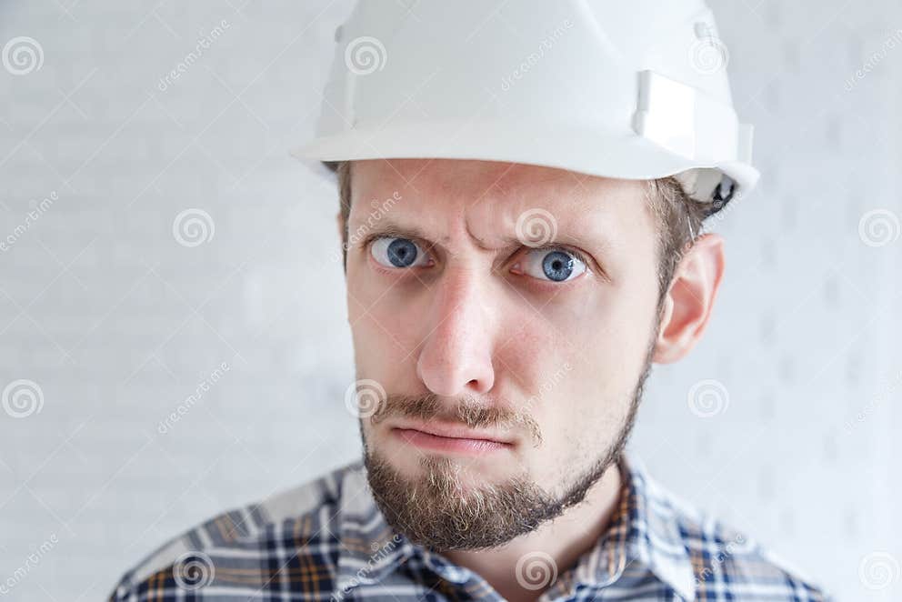 Angry or Serious Engineer in White Helmet Stock Photo - Image of ...