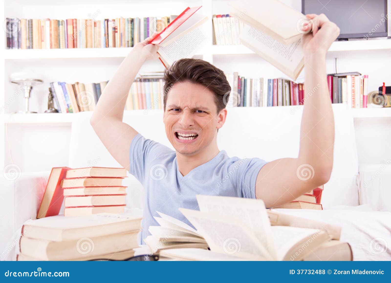 Angry Student Surrounded by Books Throws Books Stock Photo - Image of ...