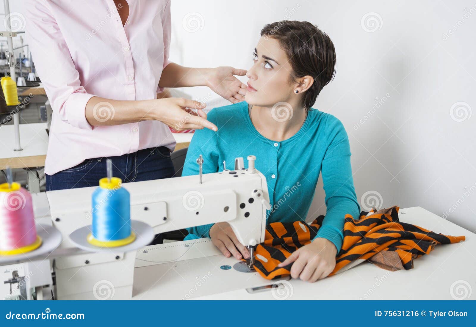 Angry Tailor Gesturing at Employee Working in Factory Stock Photo ...