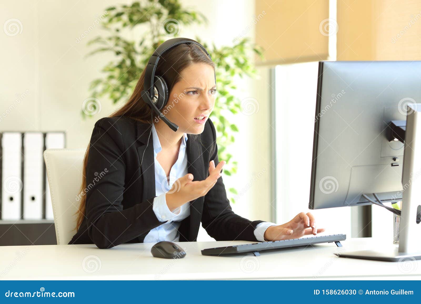 Angry Tele Marketer Attending Customer at Office Stock Photo - Image of ...