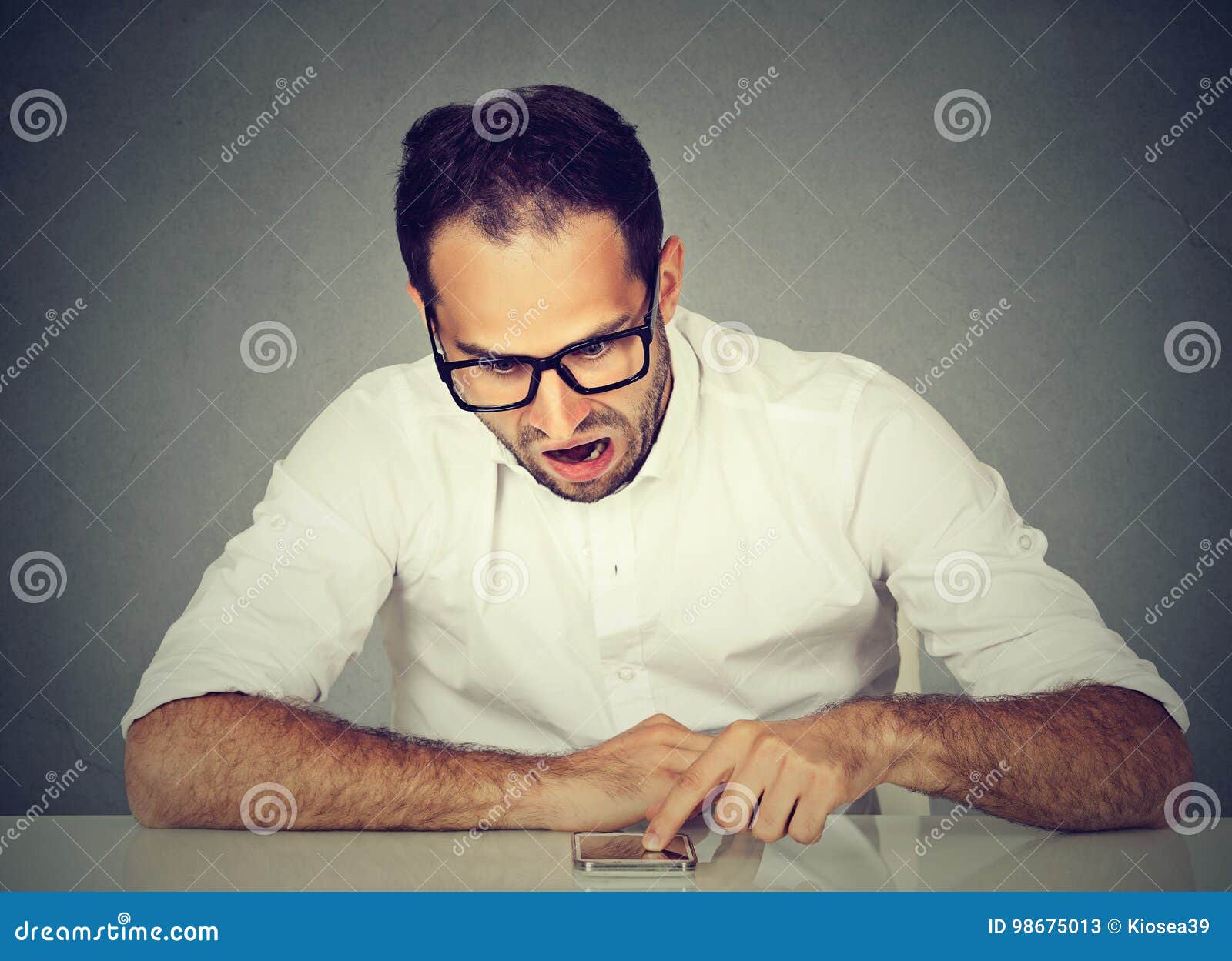 Angry Upset Young Man Using His Smartphone Stock Image - Image of ...