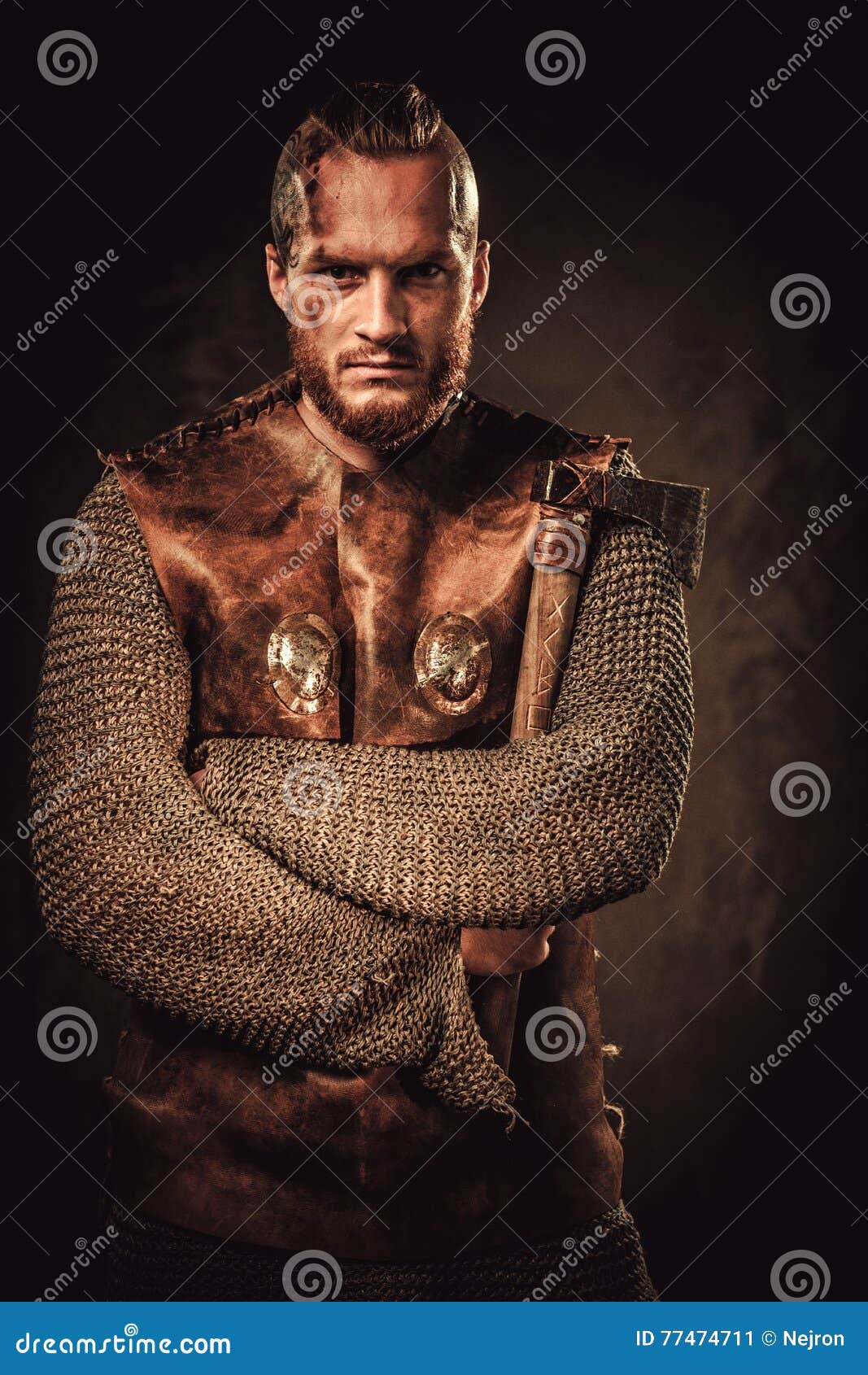 Angry Viking In A Traditional Warrior Clothes, Posing On A Dark ...